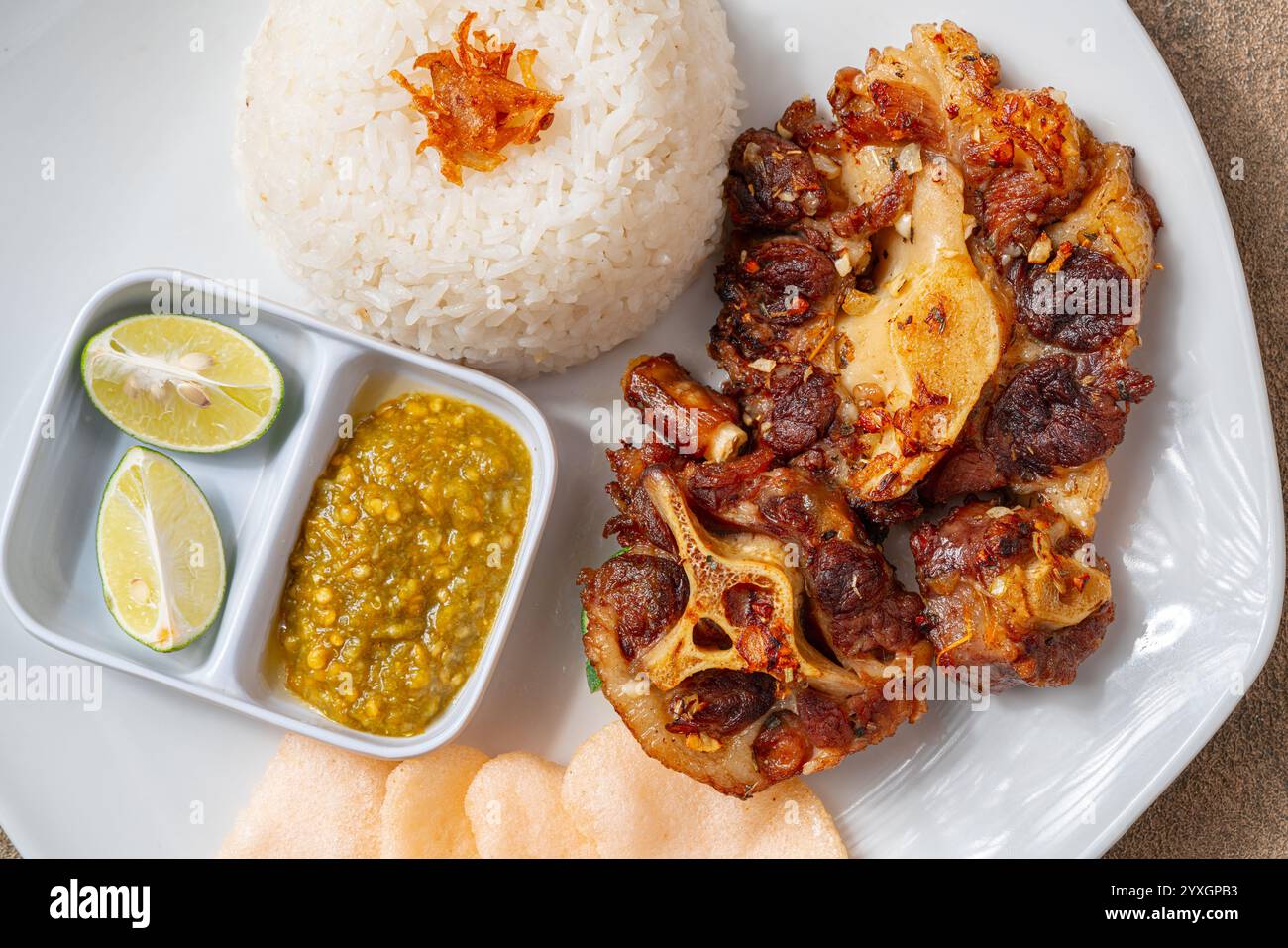 Grilled beef ribs with bbq sauce and rice Stock Photo - Alamy