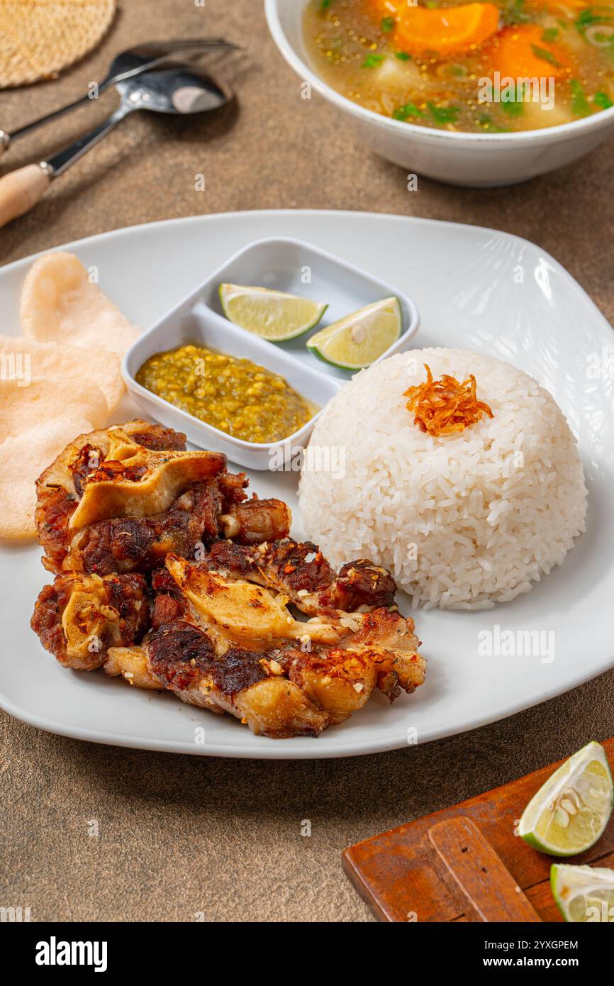 Grilled beef ribs with bbq sauce and rice Stock Photo - Alamy