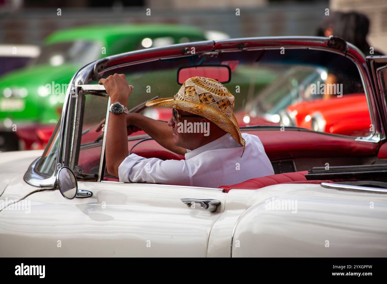 Man wearing cowboy hat driving old American cars Havana Cuba Stock ...