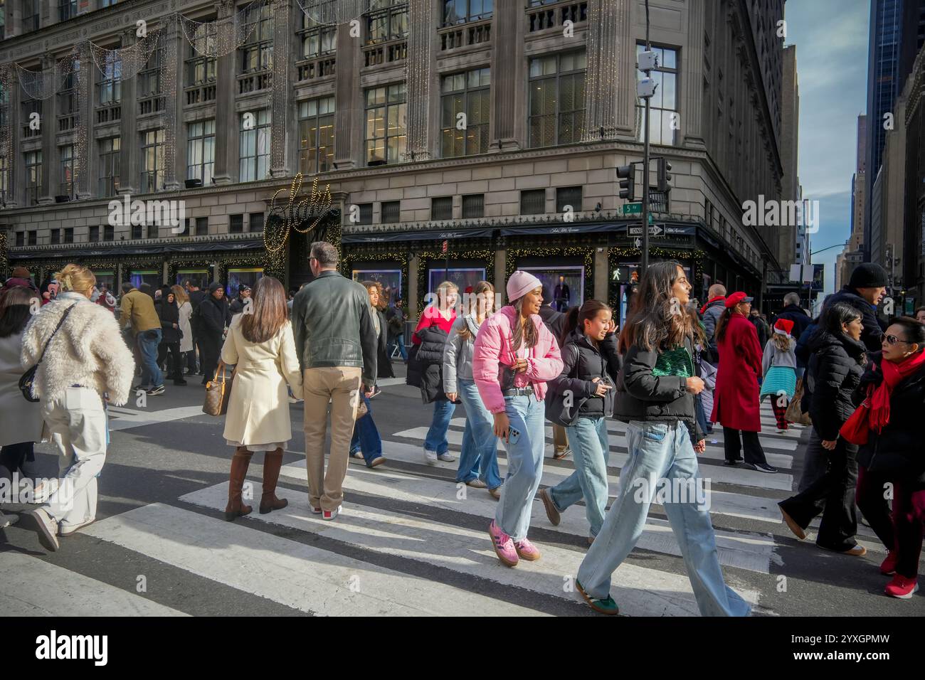 Hordes of visitors at Saks Fifth Avenue in Midtown Manhattan on Sunday ...