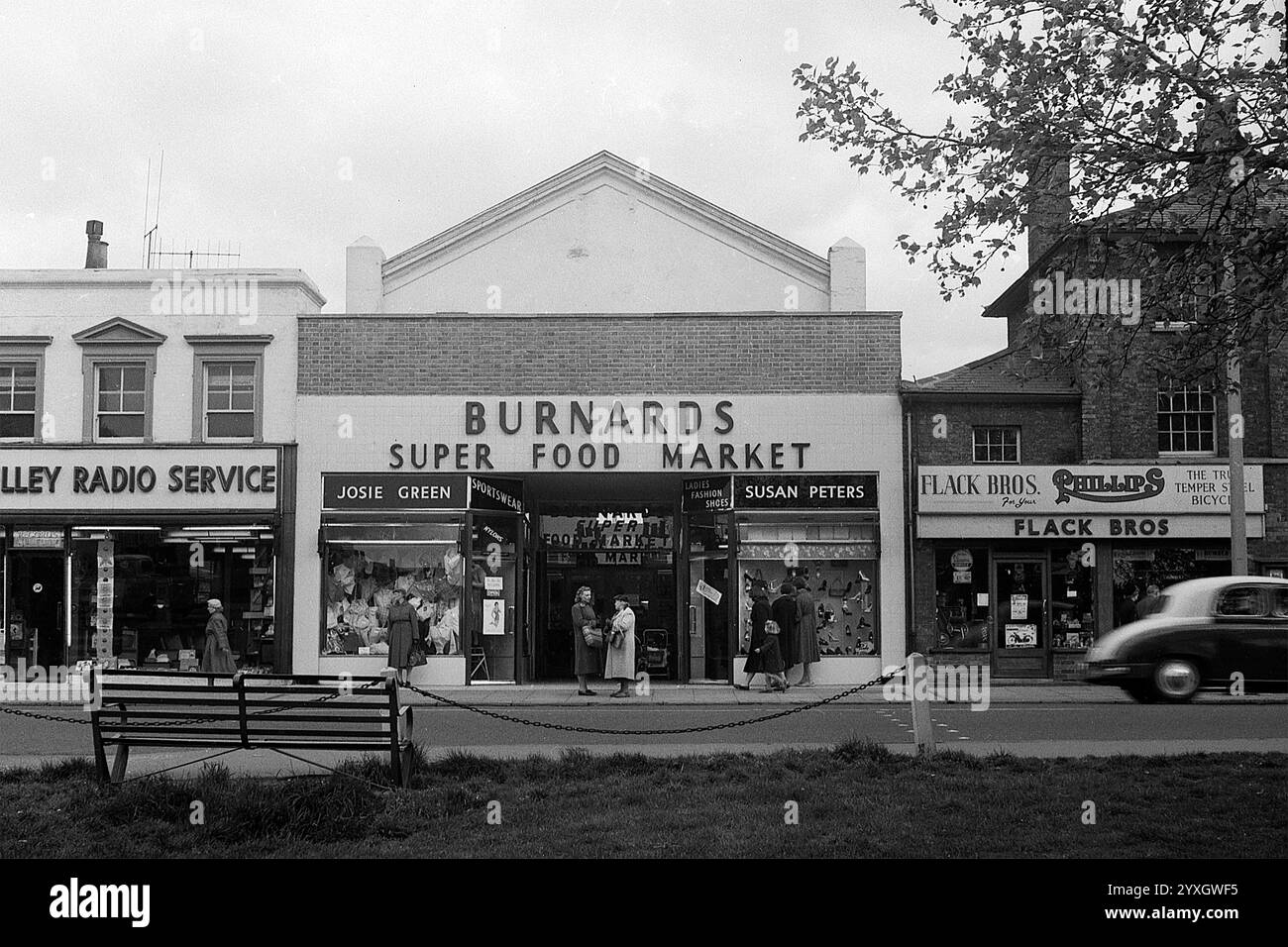 A food market, fashion retailer, shoe shop,radio shop and cycle shop in ...