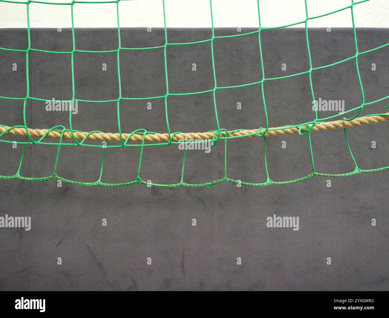 Ball protection net in a sports hall: The green, coarse-meshed net is ...