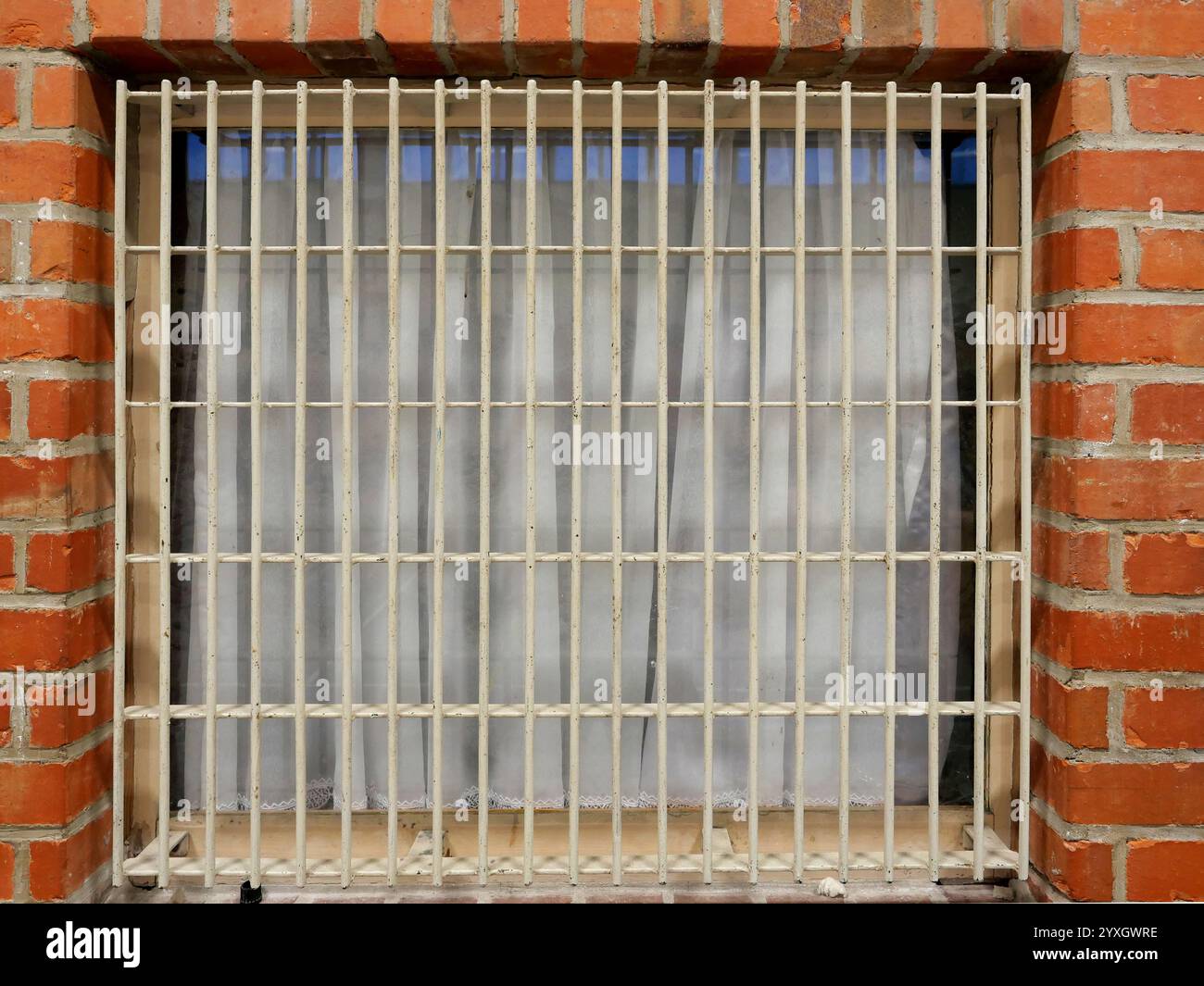 Barred window in a sports hall serves as ball protection and ...