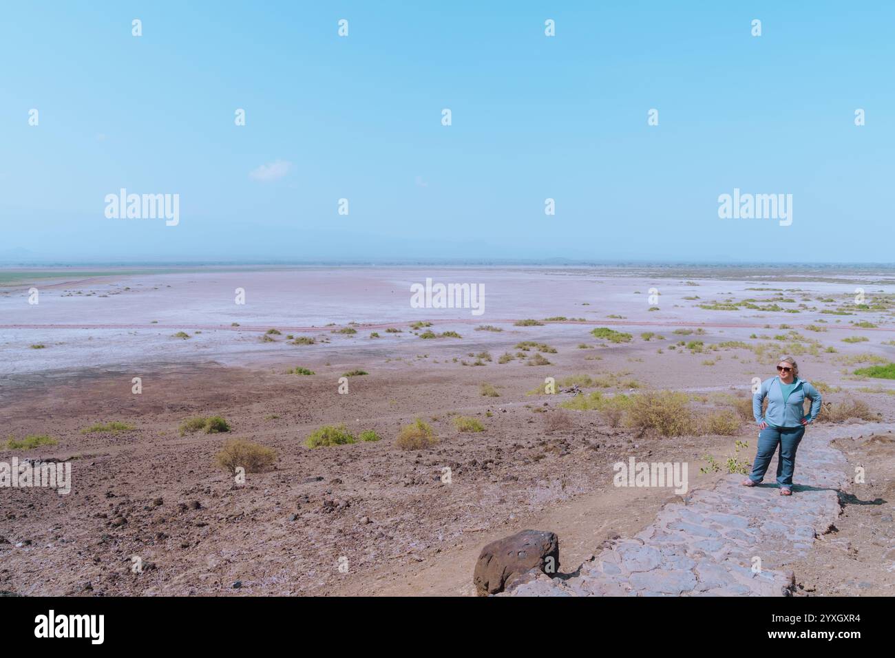 Woman hikes and enjoys the view at Observation Hill in Amboseli ...