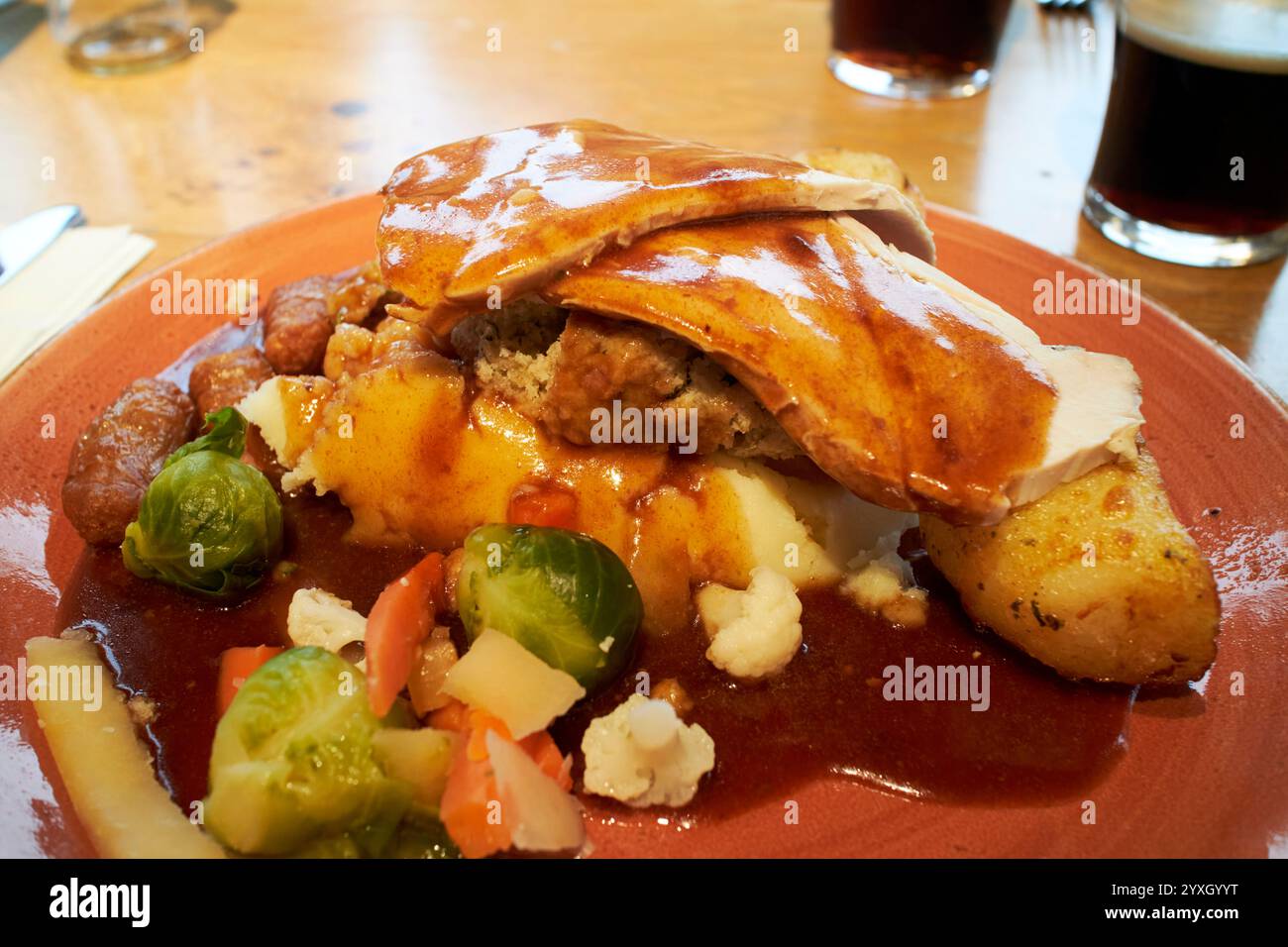 pub christmas lunch of turkey ham stuffing potatoes sprouts and veg ...