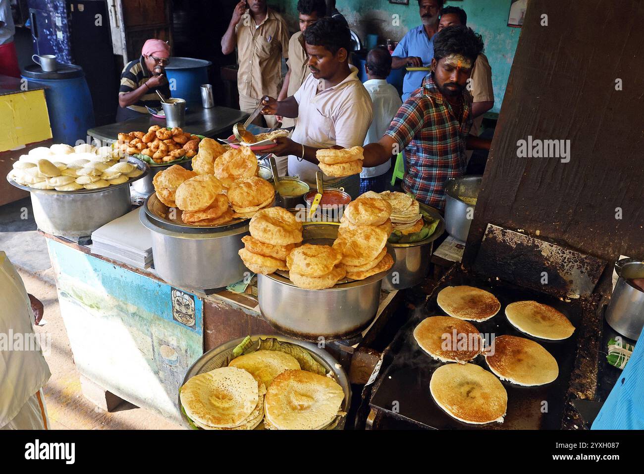 Vendor serving tiffin at a food stall in the George Town district of ...