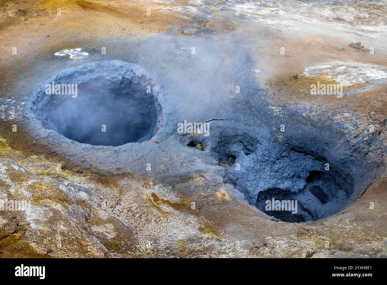 Geothermal area emitting steam and smoke in iceland Stock Photo - Alamy