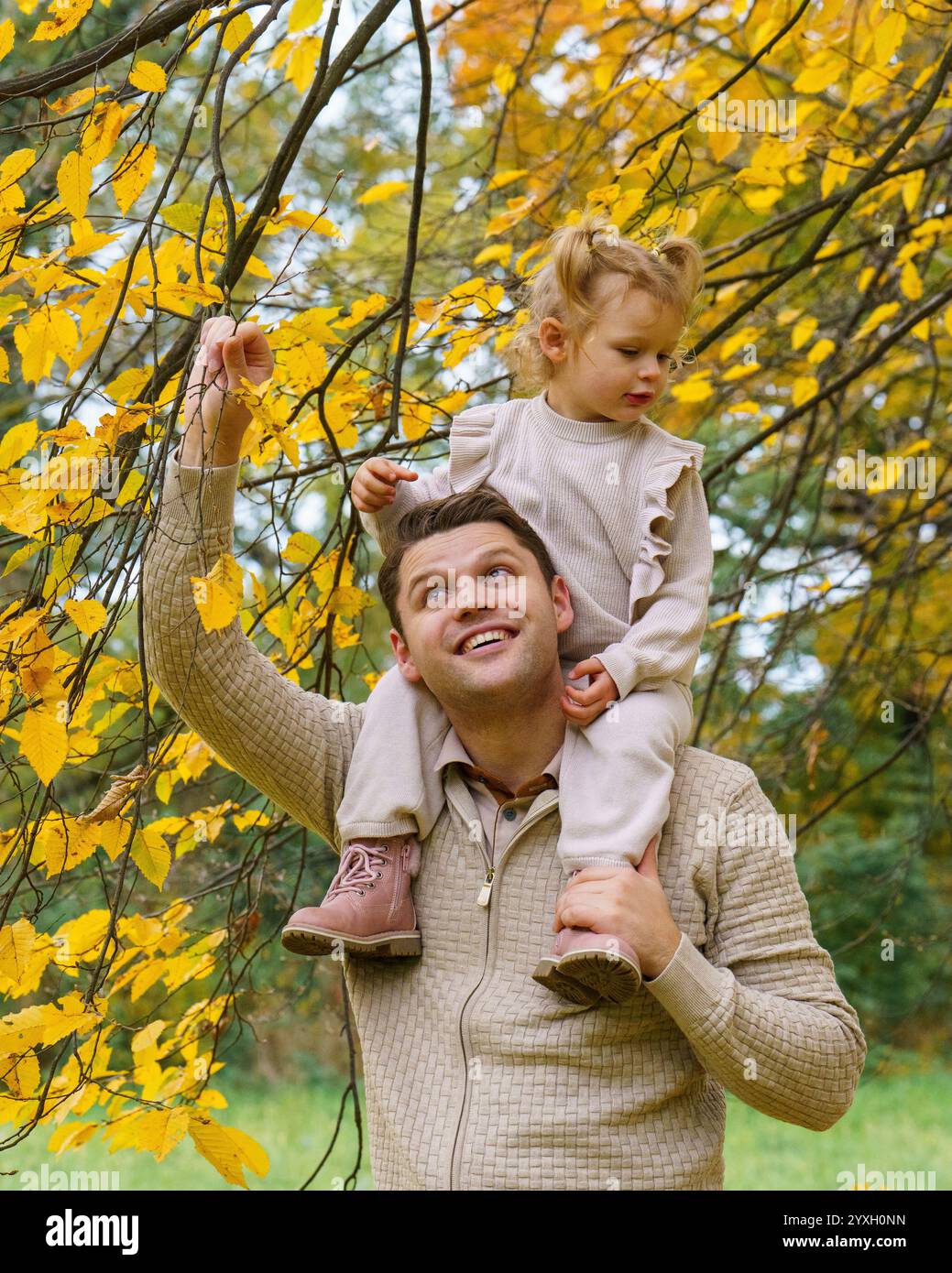 Joyful father and young daughter playing while walking in beautiful ...