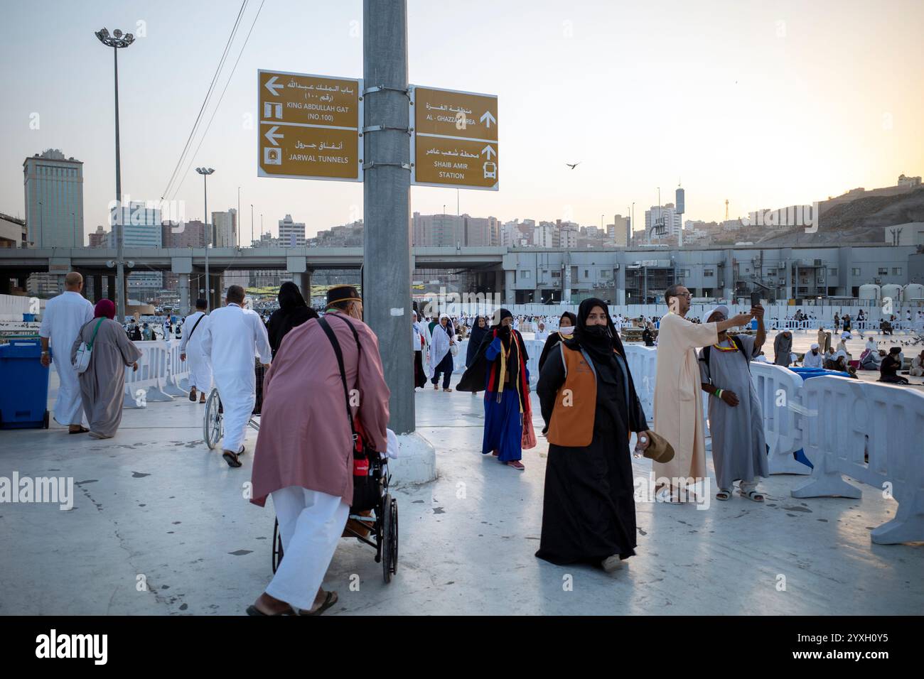Mecca, Saudi Arabia - June 5, 2024: Hajj and Umrah pilgrims from around the world walking near ...