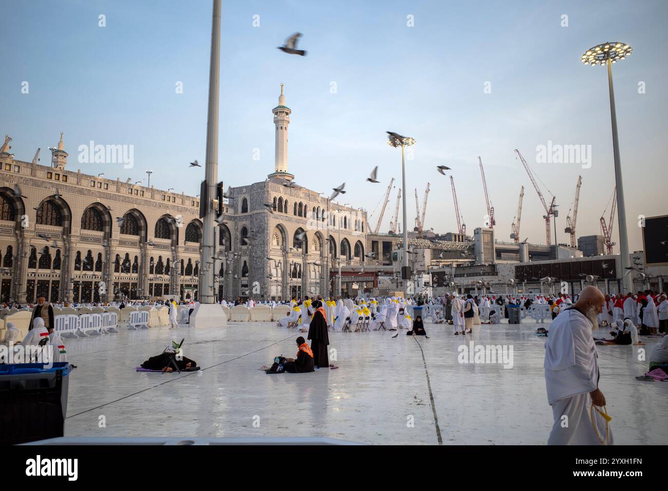 Mecca, Saudi Arabia - June 4, 2024: Hajj and Umrah pilgrims from around the world walking near ...