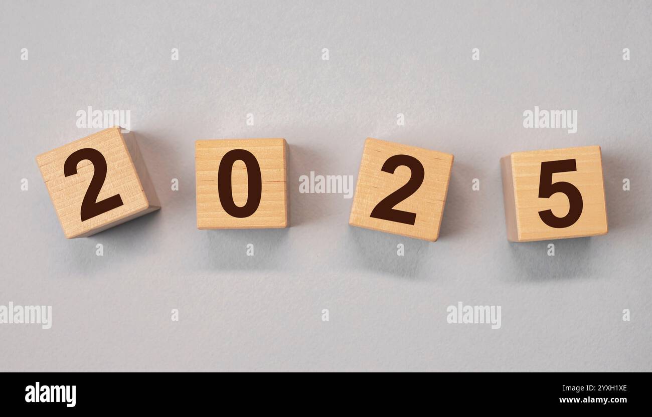 2025 new year, text numbers on wooden block cubes Stock Photo - Alamy