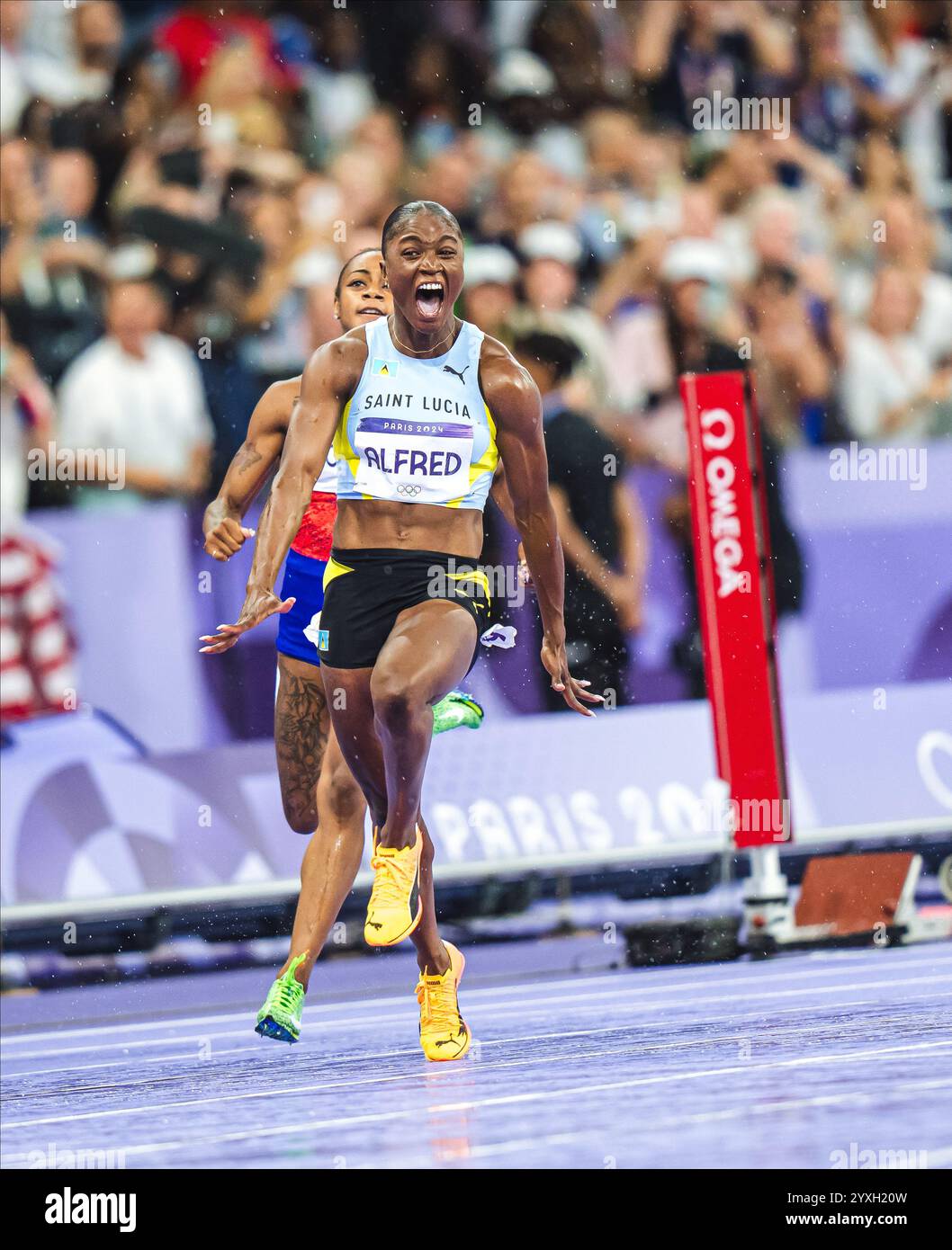 Julien Alfred winning in the 100 meters relay at the Paris 2024 Olympic ...