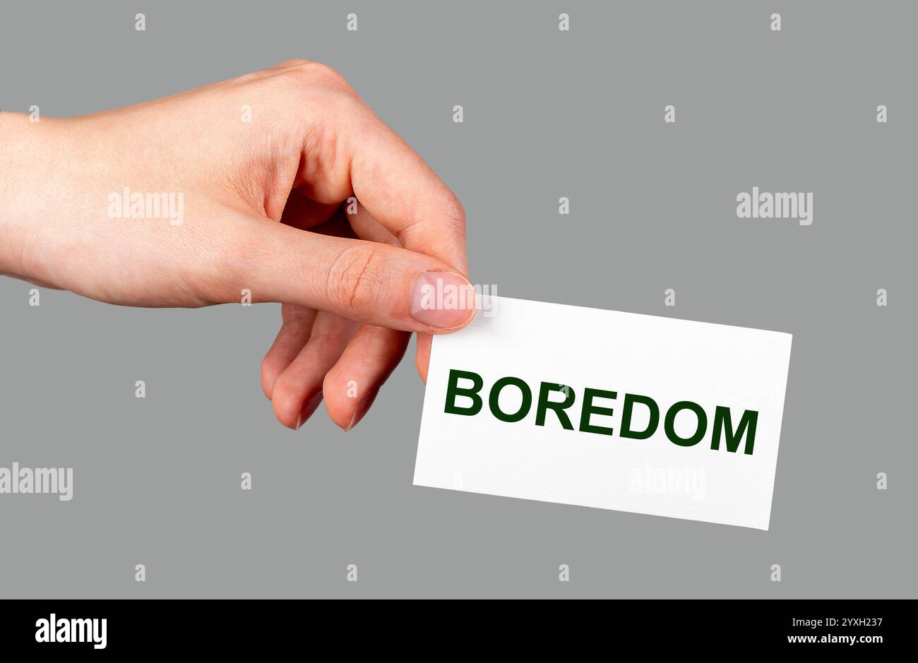 Boredom word, text on paper in hand, boring life, psychology concept ...