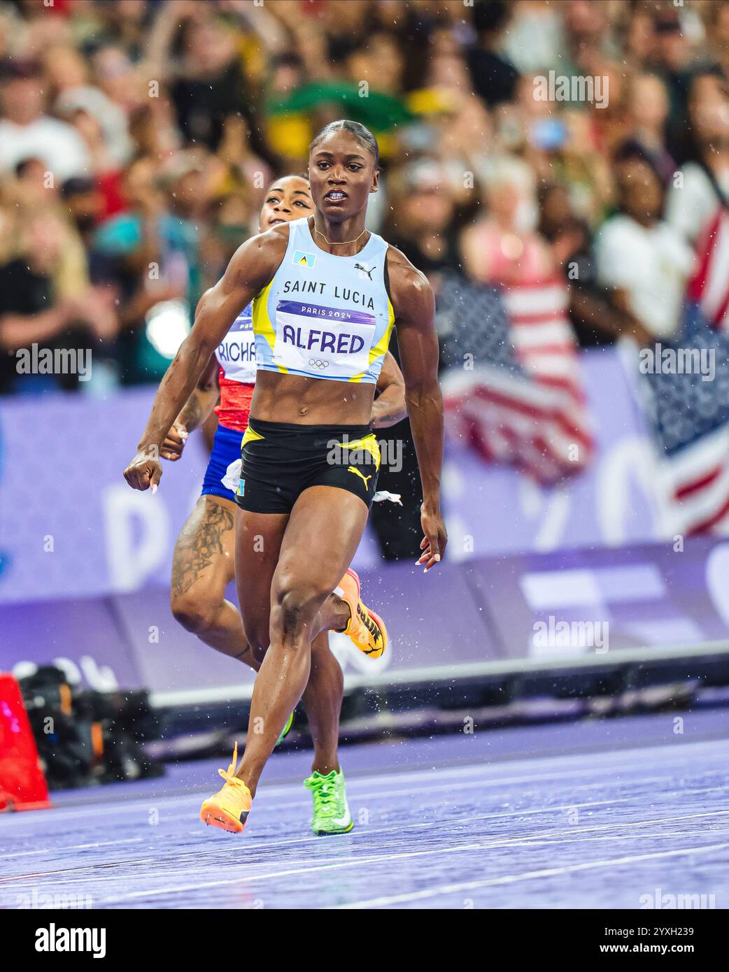 Julien Alfred winning in the 100 meters relay at the Paris 2024 Olympic ...