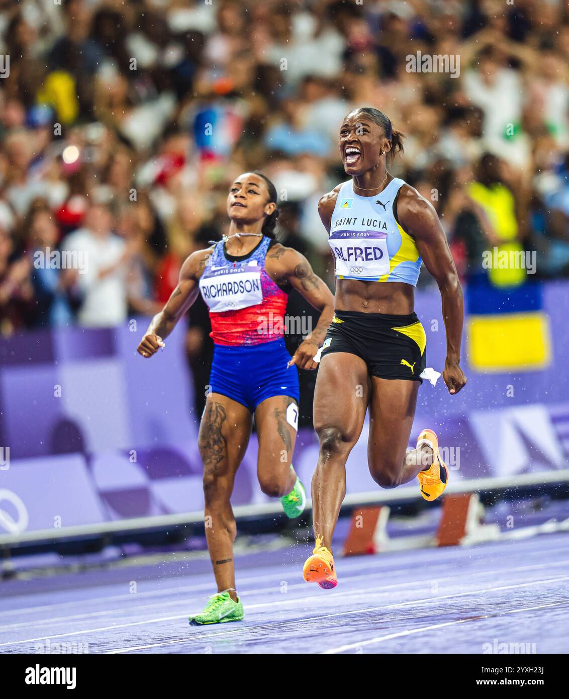 Julien Alfred winning in the 100 meters relay at the Paris 2024 Olympic ...