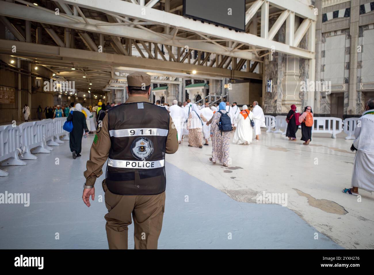 Mecca, Saudi Arabia - June 5, 2024: Saudi Arabia Police walking near the Al Haram Mosque, Makkah ...