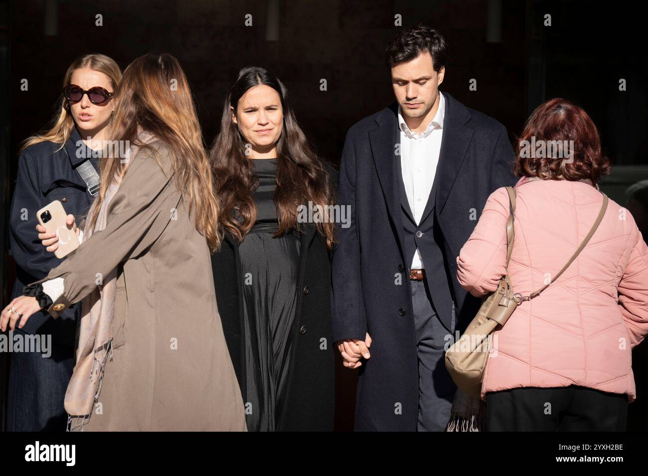 Carolina Monje and her husband, Álex Lopera, leave the funeral chapel ...