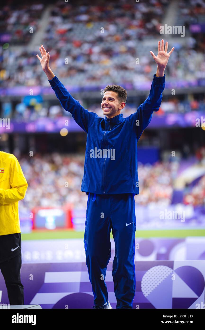 Grant Fisher at the award ceremony and collecting her medal at the ...
