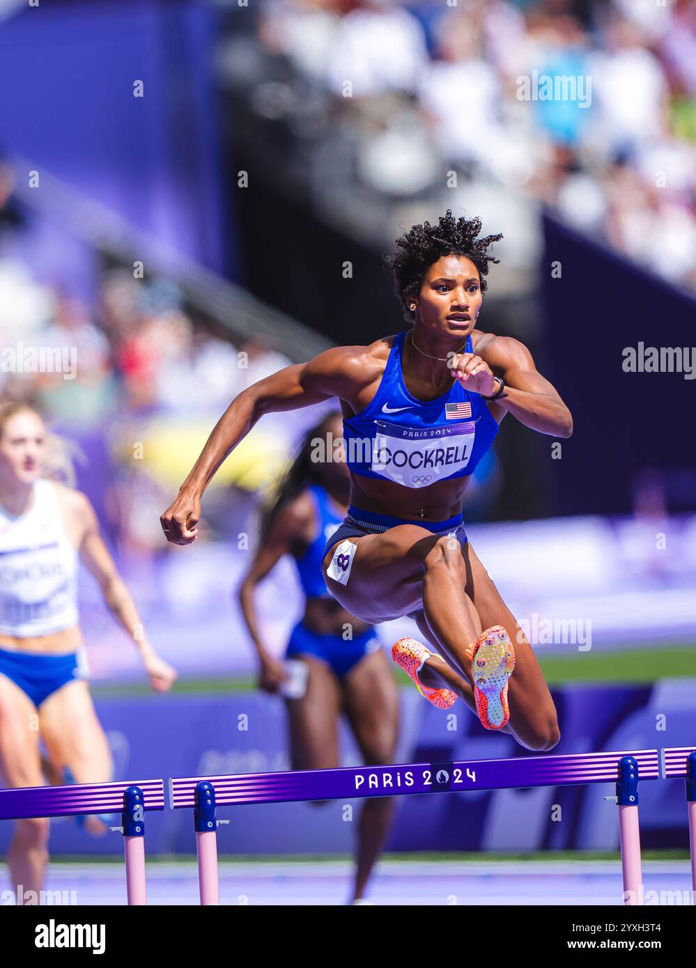 Anna Cockrell participating in the 400 meters hurdles at the Paris 2024 ...