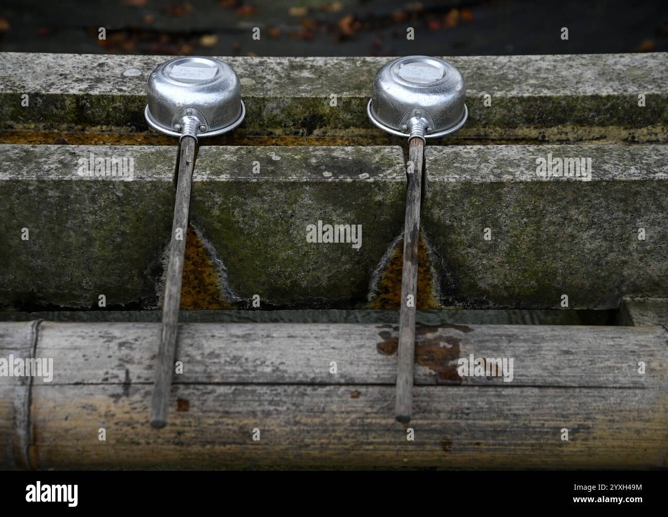 Traditional Japanese Tsukubai stone water basin with handcrafted pewter ...