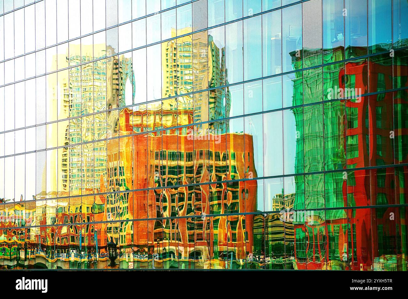 Reflections of old and new buildings in the Boston skyline are visible ...