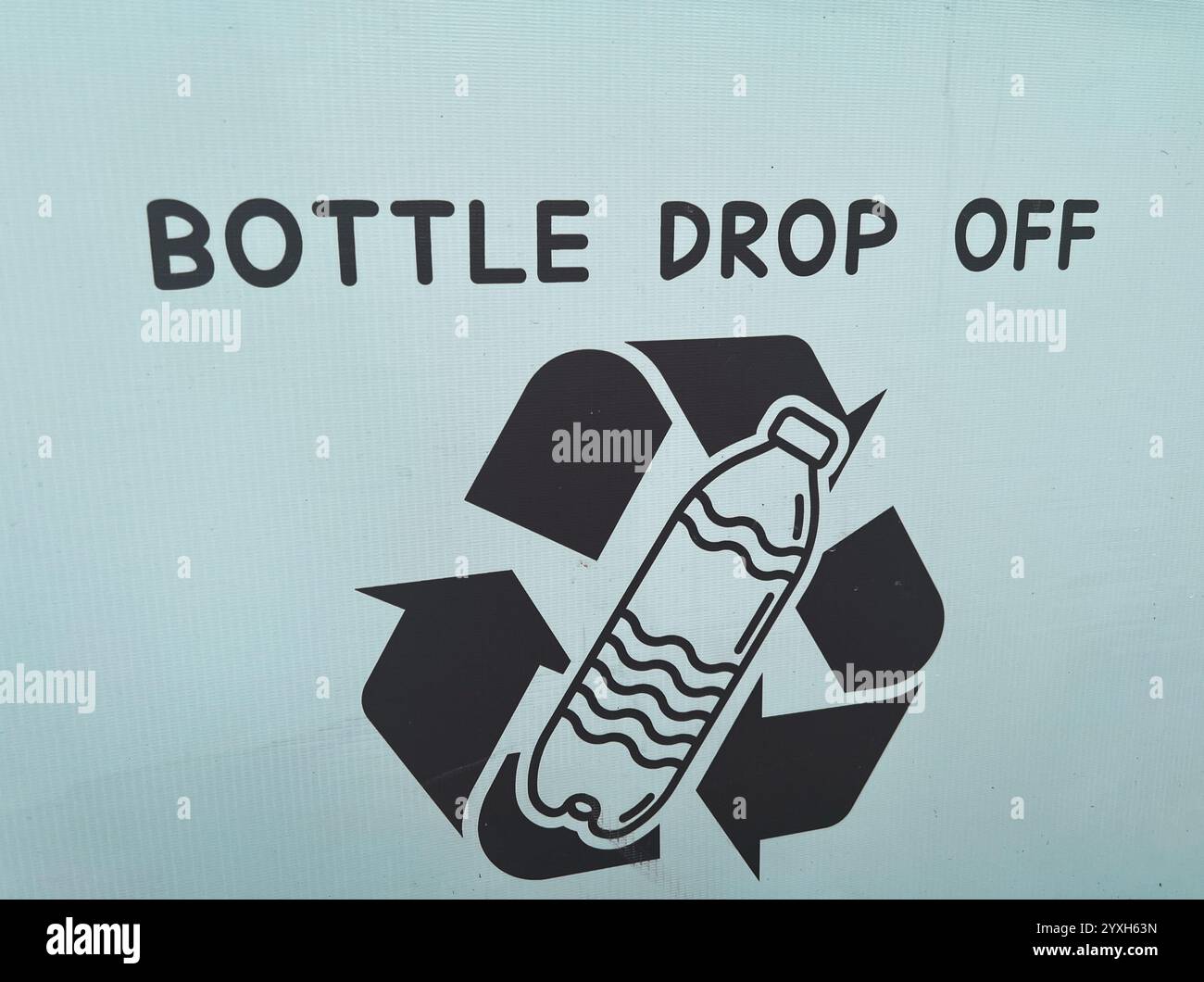 Sign showing "BOTTLE DROP OFF" text with recycling symbol incorporating ...