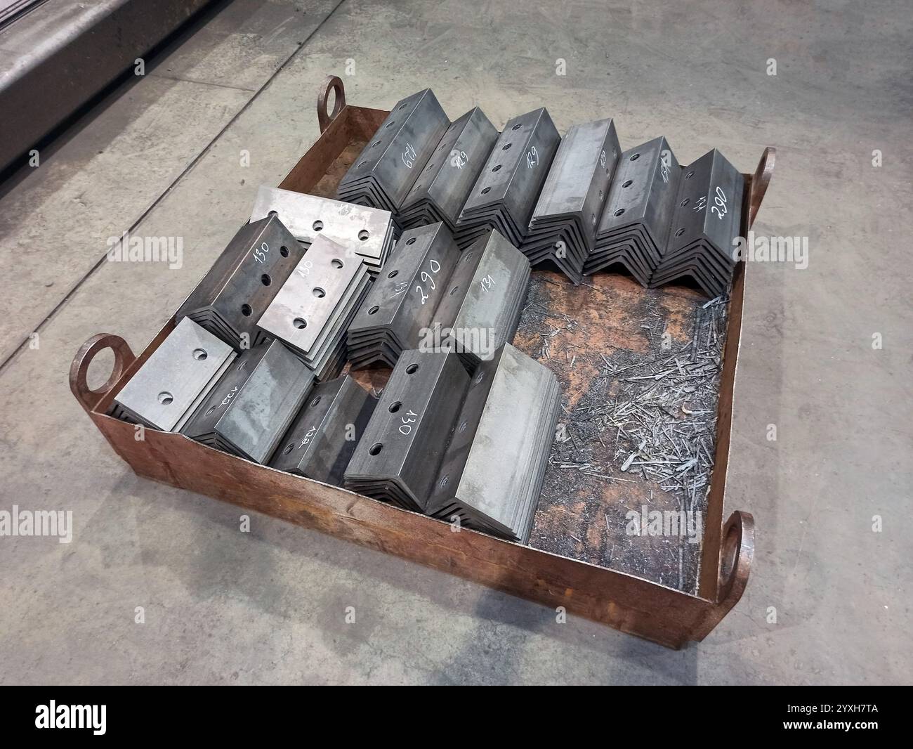 Metal cutting processing. Corner with holes. Warehouse of finished ...