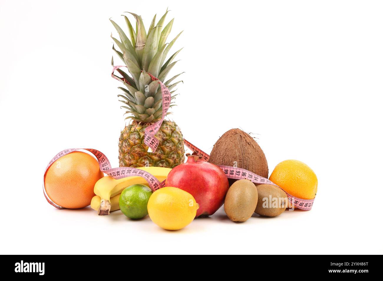 Fruits composition with tape measure. White background Stock Photo - Alamy