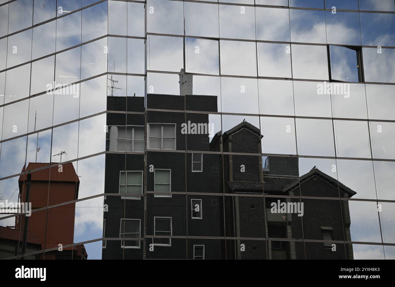 Reflection on the windows of a high rise building in Kawaramachi, Kyoto ...