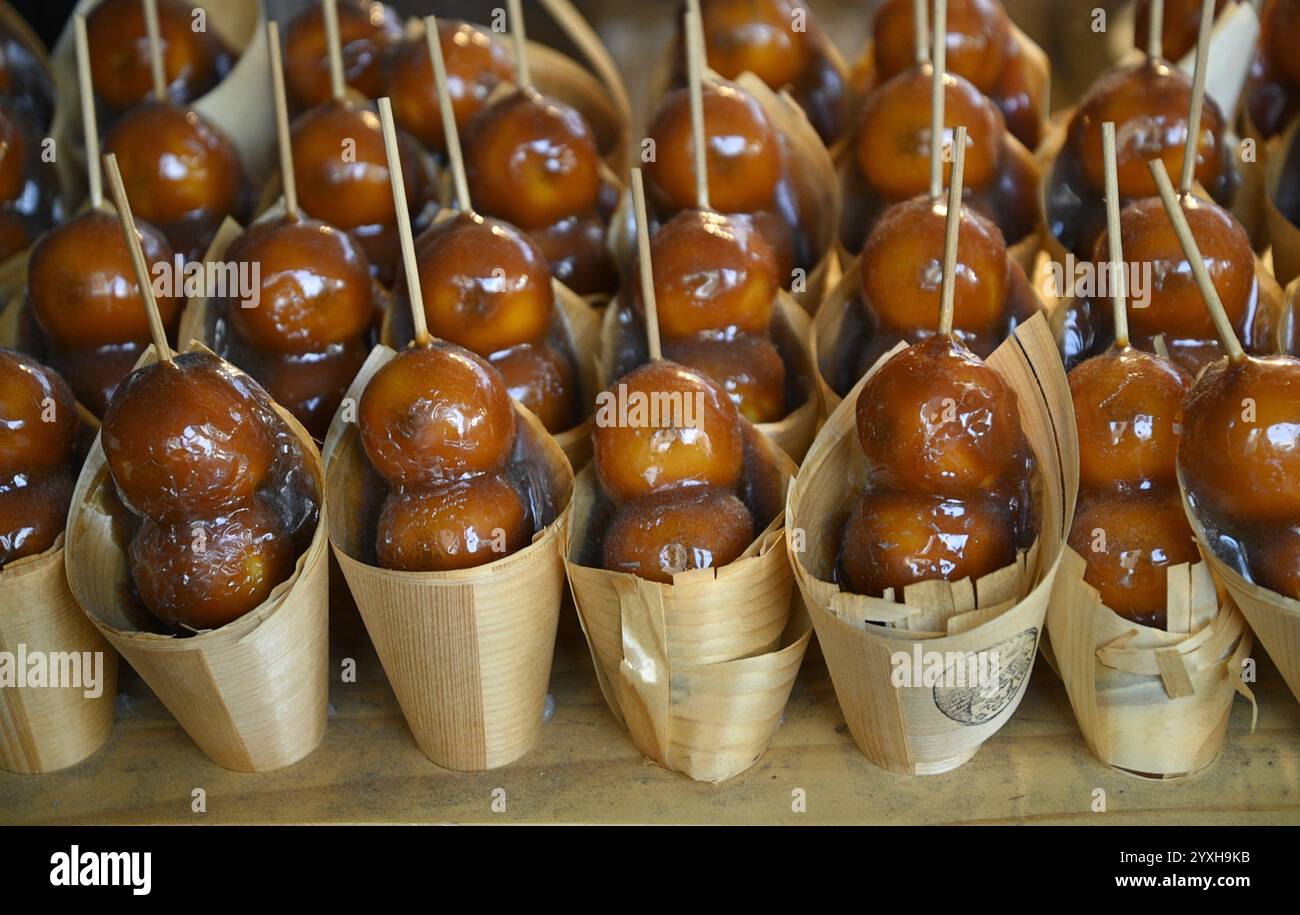 Mitarashi dango skewered onto sticks, a traditional Japanese rice ...