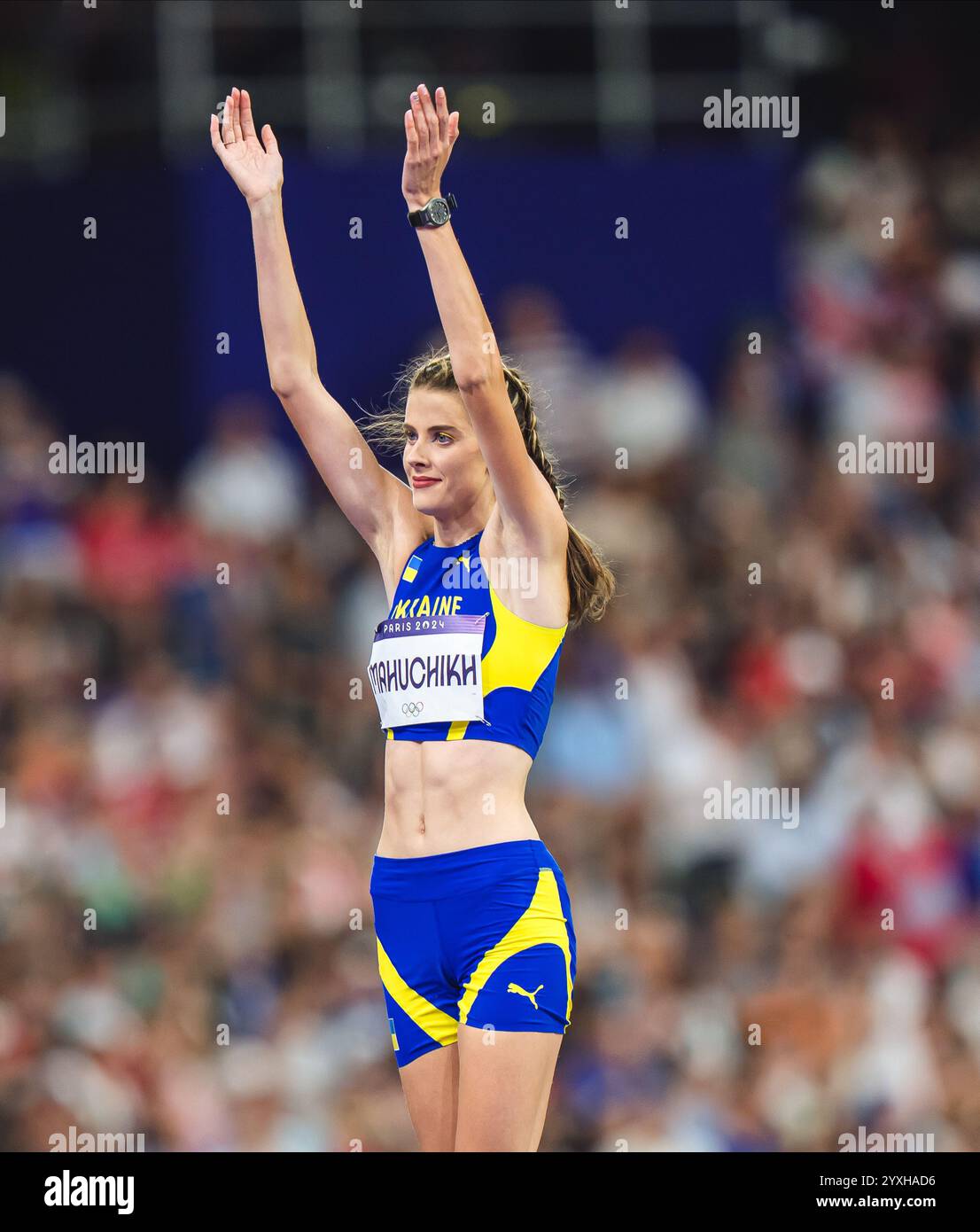 Yaroslava Mahuchikh celebrating her medal with her country's flag at ...