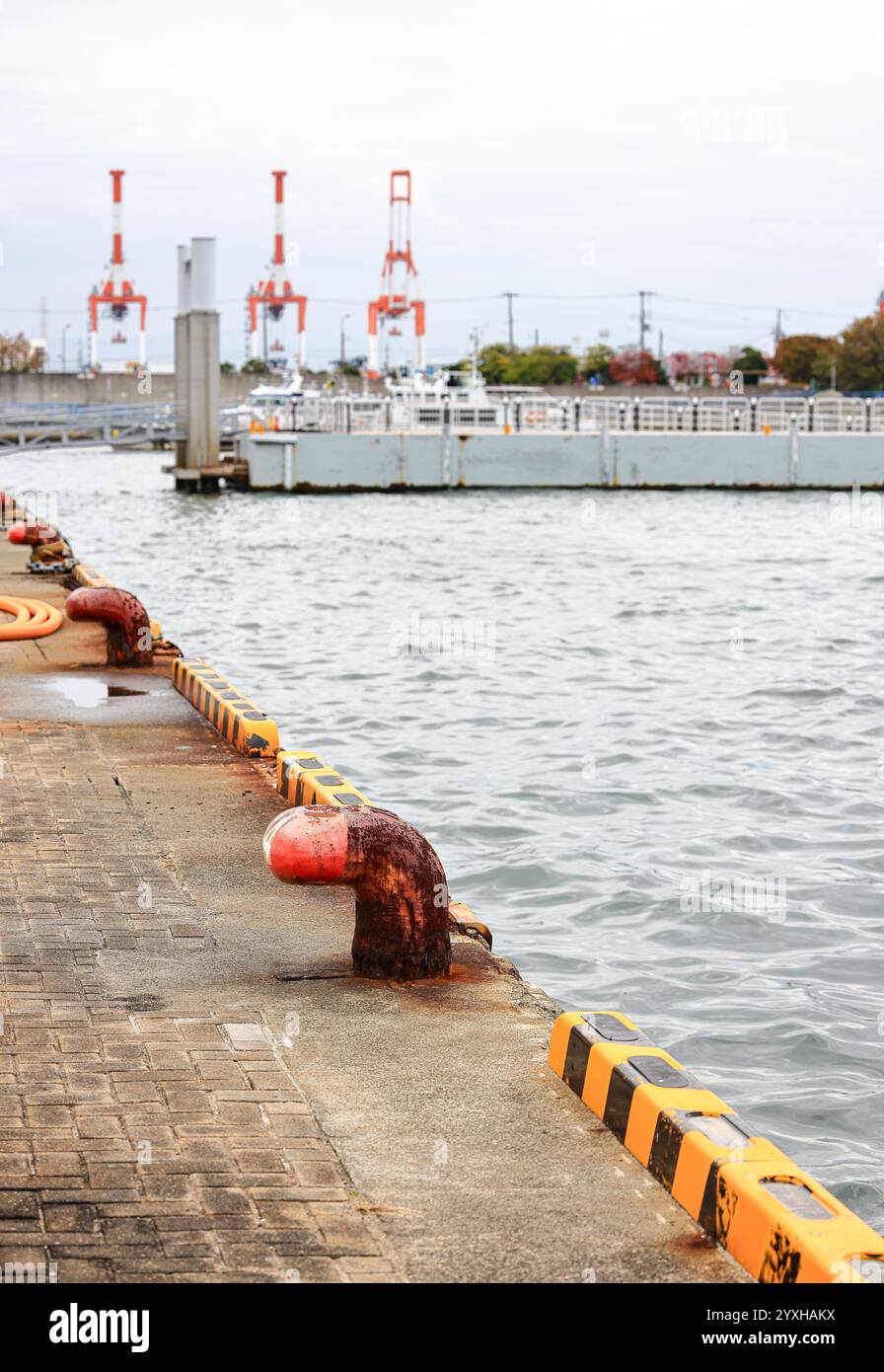 Mooring rusty bollard on pier referred to a post on a ship or quay ...
