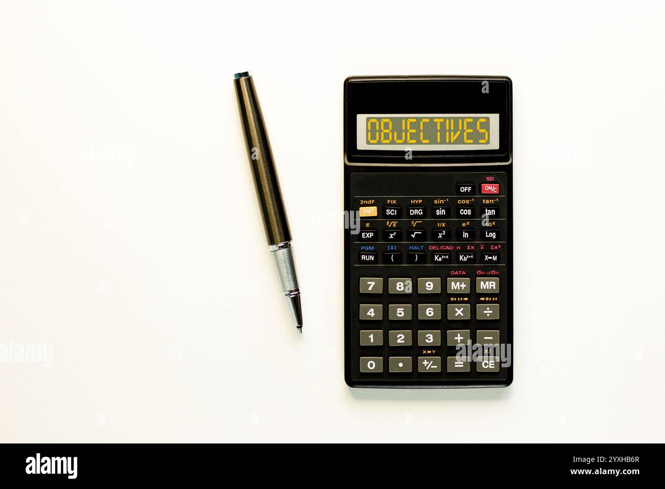 Objectives symbol. Concept word Objectives on beautiful black calculator. Beautiful white paper ...