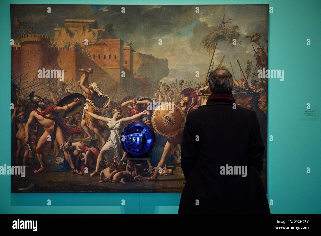 A man closely examines Jeff Koons' artwork Gazing Ball (David ...
