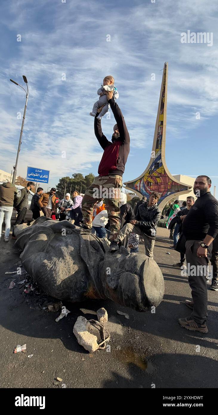 The demolished statue of Hafez al-Assad in the streets of Damascus ...
