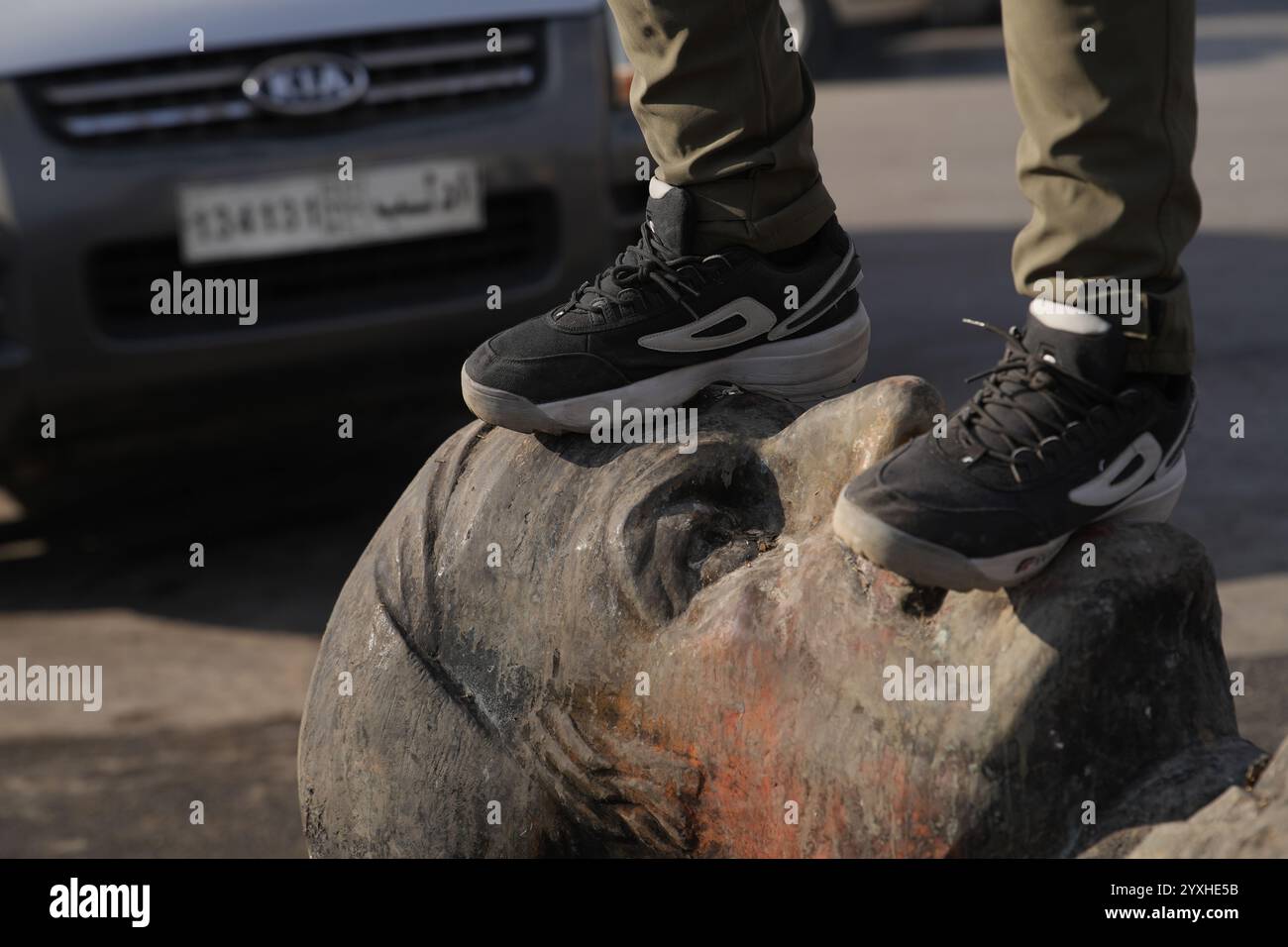The demolished statue of Hafez al-Assad in the streets of Damascus ...