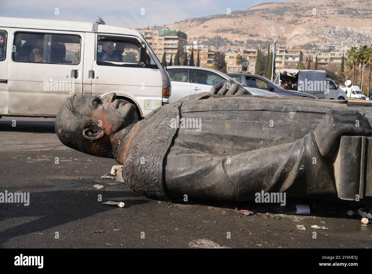 The demolished statue of Hafez al-Assad in the streets of Damascus ...