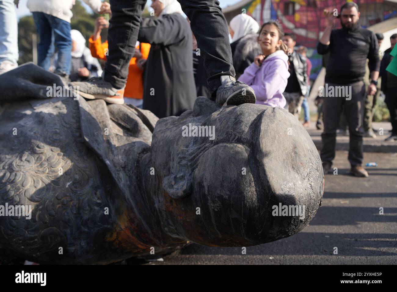 The demolished statue of Hafez al-Assad in the streets of Damascus ...
