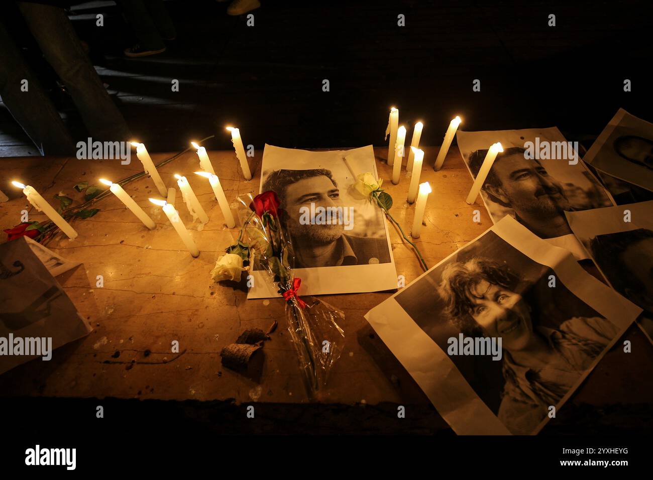 Beirut, Beirut, Lebanon. 16th Dec, 2024. Candles are lit near pictures ...
