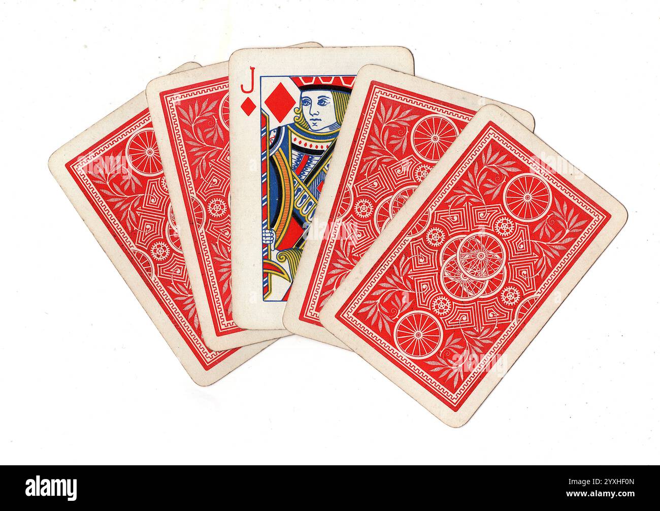 A hand of vintage playing card backs with the jack of diamonds revealed ...
