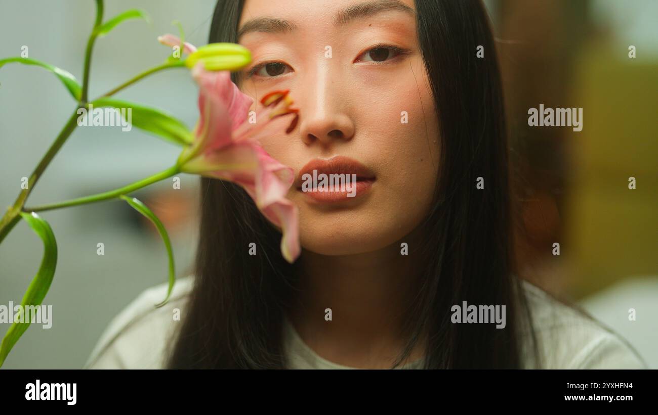Asian woman portrait face beauty female sensual Chinese Korean Japanese girl face pink flower ...