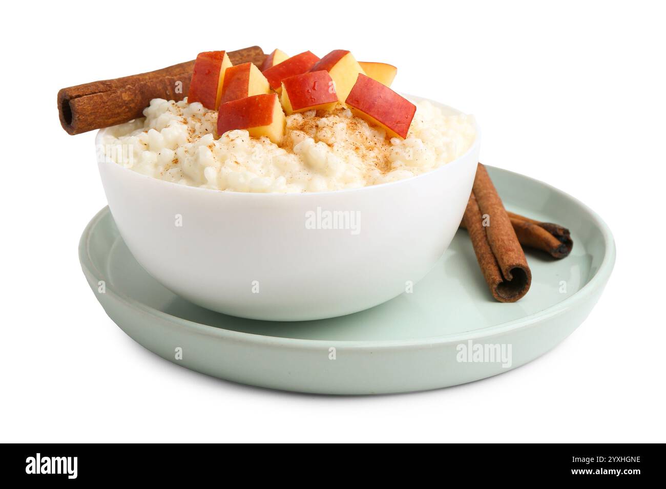 Delicious rice pudding with apples and cinnamon isolated on white Stock ...