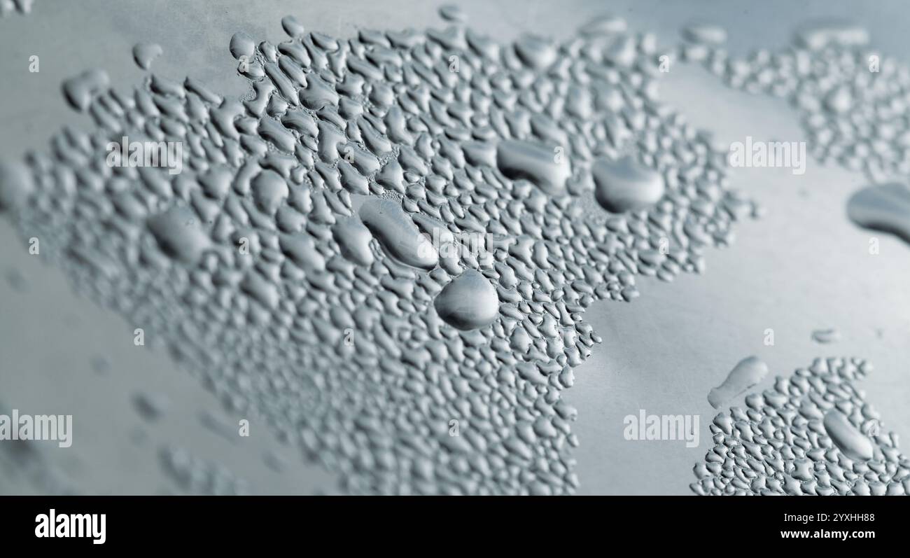 Macro background with water droplets condensation pattern on metal ...