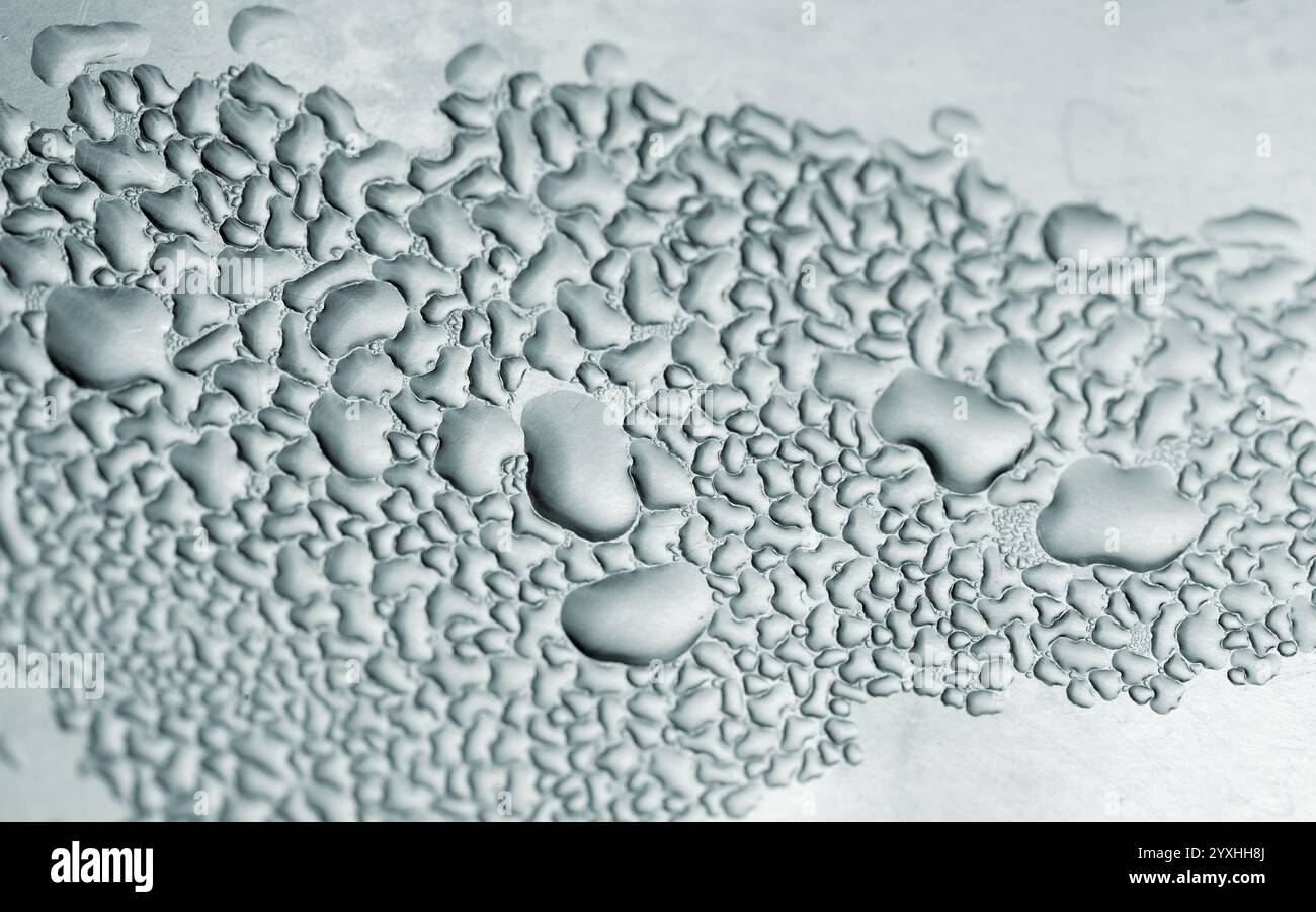 Macro background with water droplets condensation pattern on metal ...