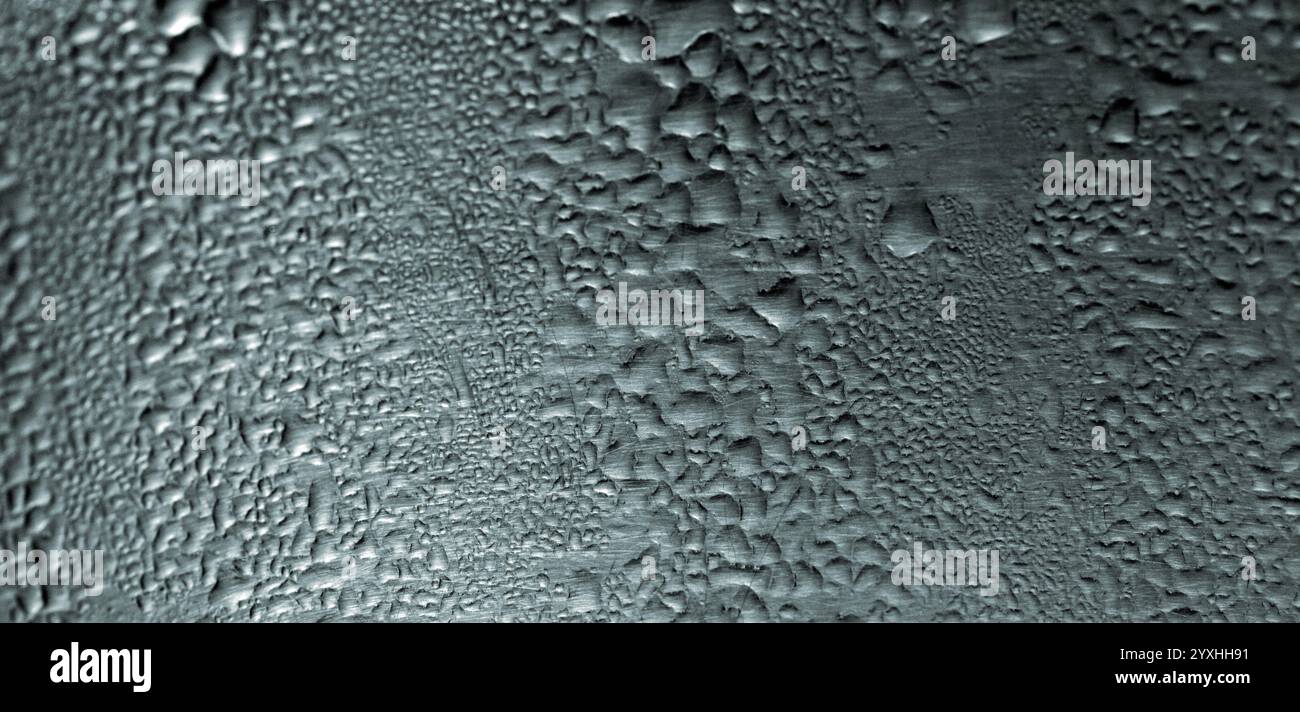Macro background with water droplets condensation pattern on metal ...