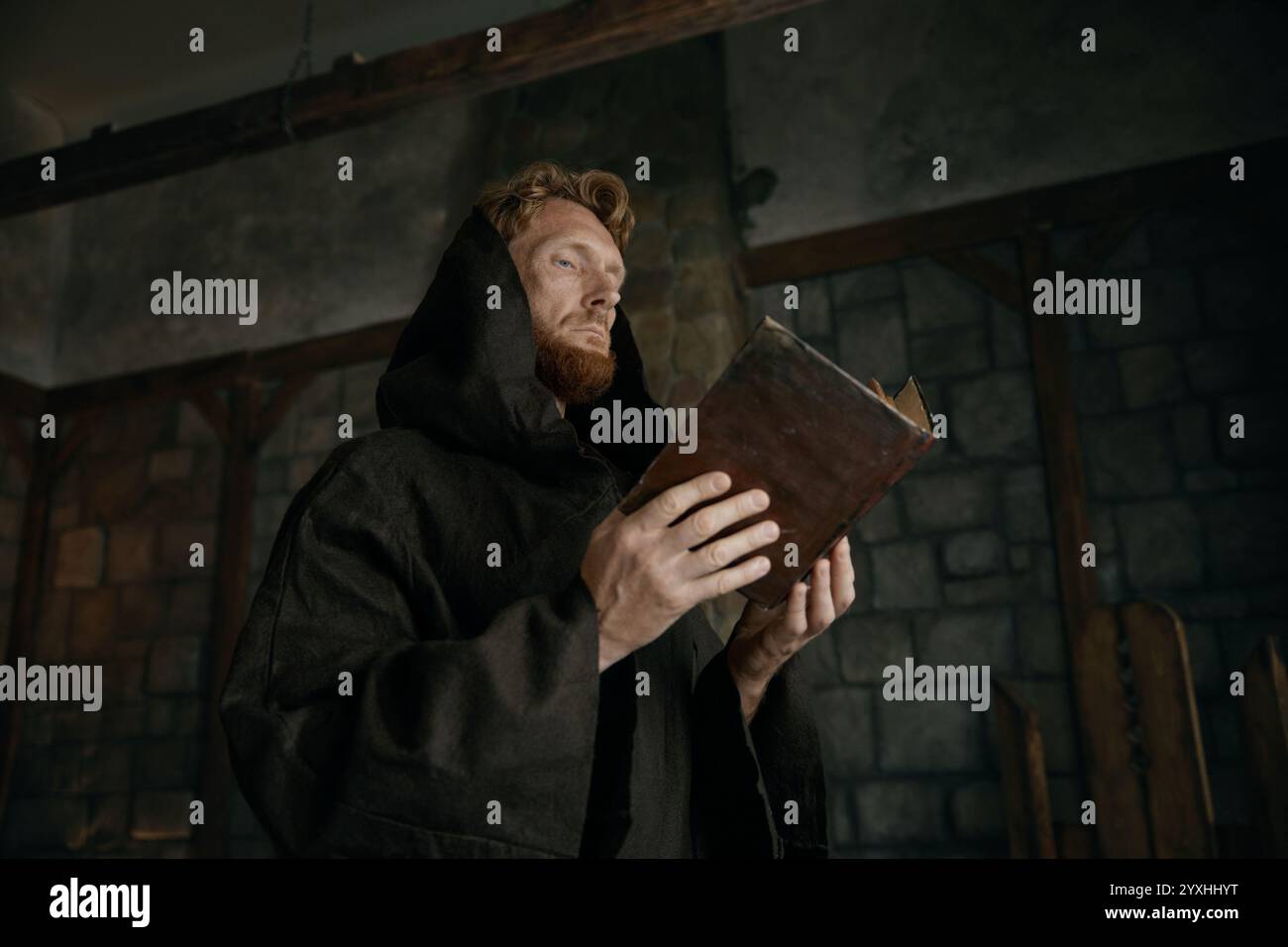 Monk reading vintage mysterious book hi-res stock photography and ...