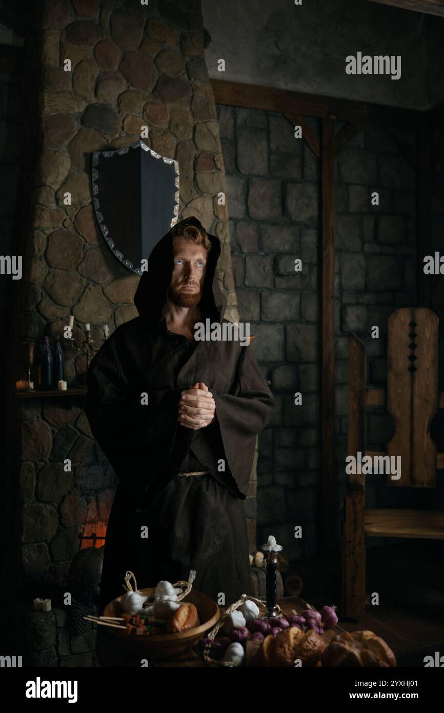 Thoughtful medieval monk standing in cathedral Stock Photo - Alamy