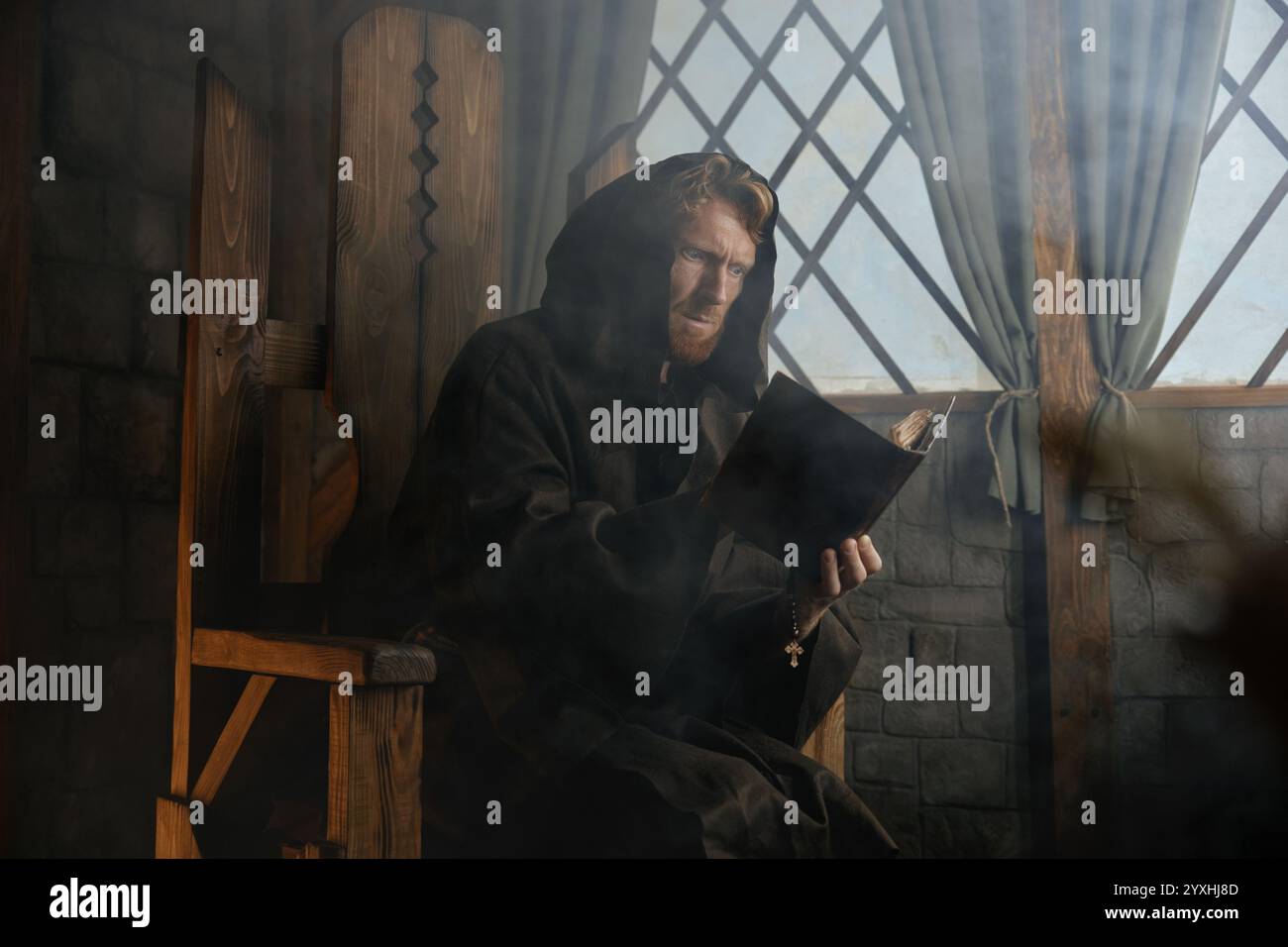 Old medieval monk reading sacred religious book praying with rosary ...