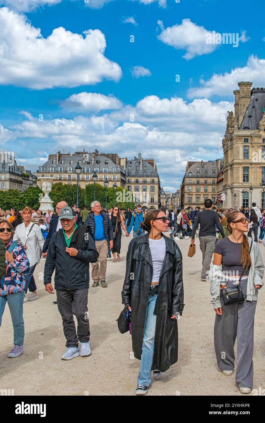 Hundreds of tourists at the Louvre in Paris, France, the new modern day ...