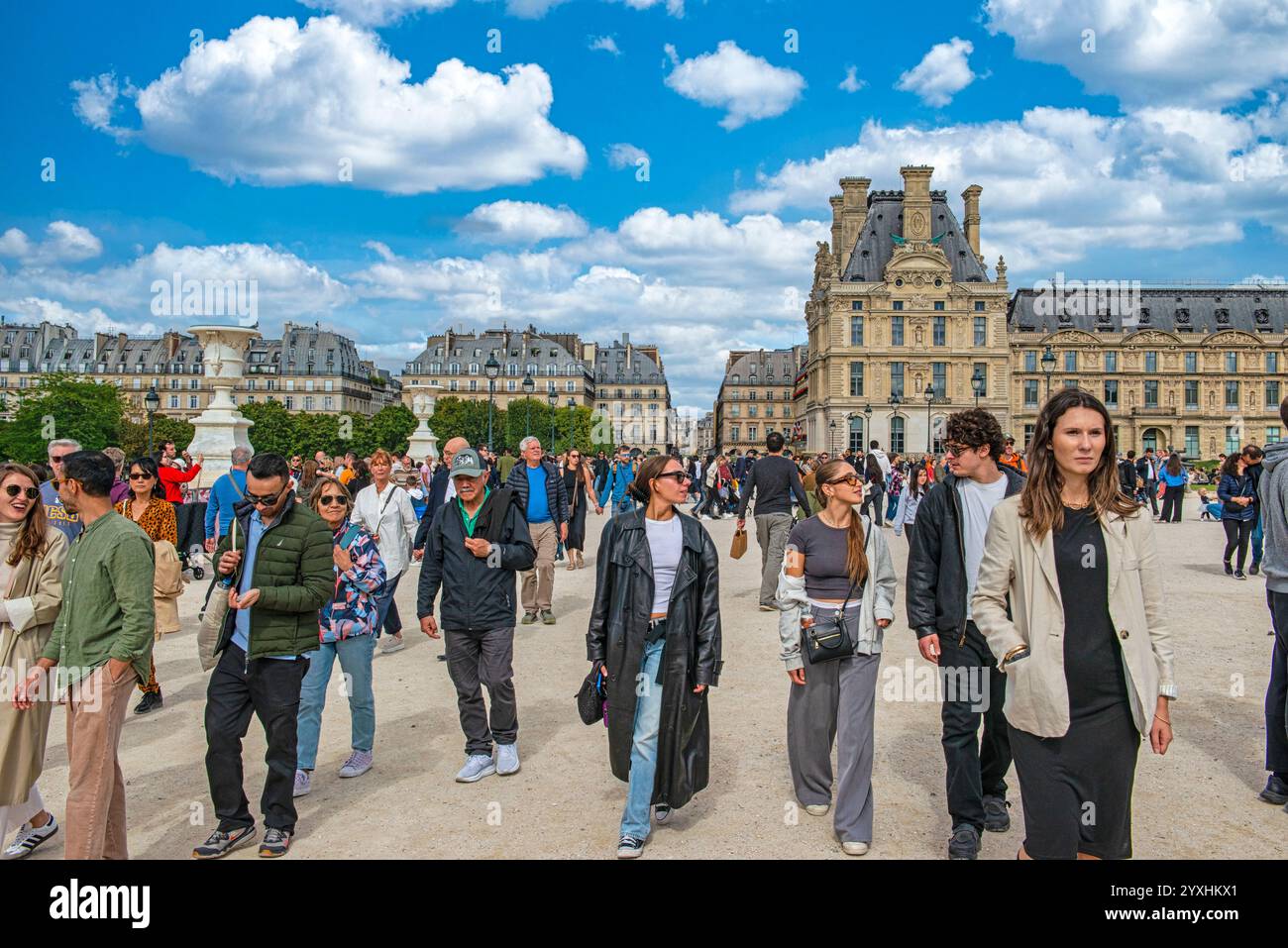 Hundreds of tourists at the Louvre in Paris, France, the new modern day ...